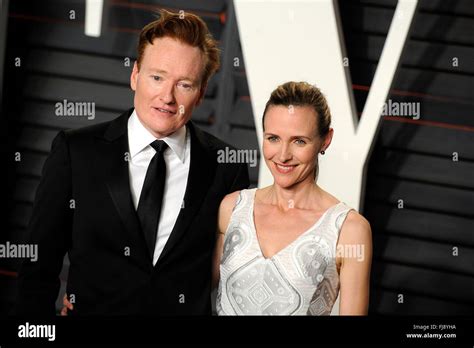 Comedian Conan Obrien L And Liza Powel Attending The 2016 Vanity