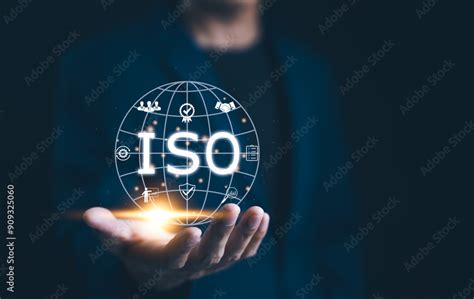 ISO Standards And Quality Assurance Concept Businessman Presenting Globe With Various ISO Icons