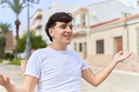 Premium Photo Non Binary Man Smiling Confident Speaking At Park