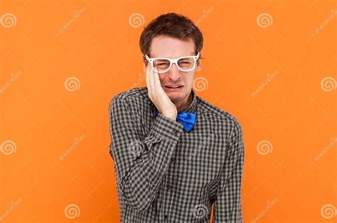 Man Nerd With Sorrowful Expression Cries With Despair Regrets Doing Something Wrong Squints