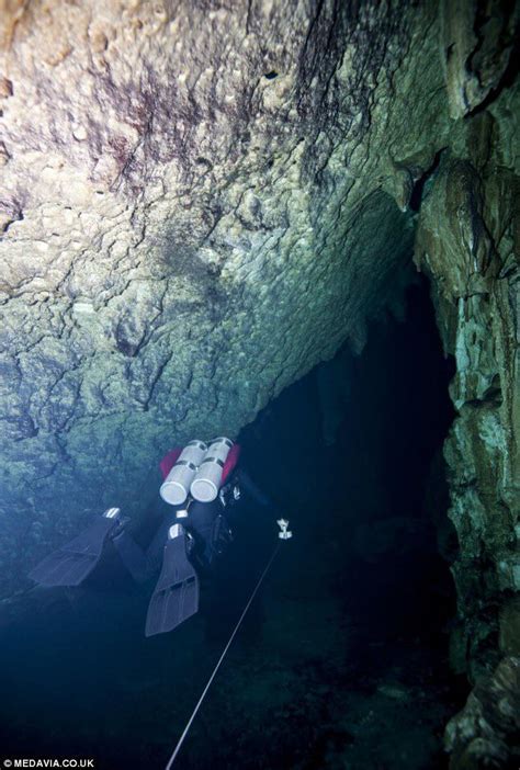 A Scuba Diver Proceeding Into An Underwater Cave Thalassophobia