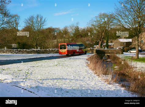 A View Of The Local Bus As It Drives Through The Village Downham