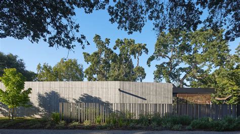 Tall Acoustic Wall Buffers Noise At Modal Home In Silicon Valley