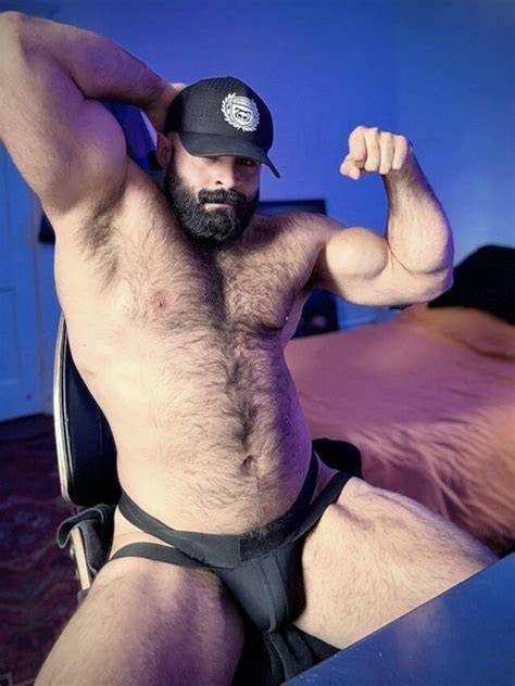 Whats The Name Of This Hairy Guy Flexing His Muscles In A Black