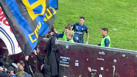 Energetic Goal Celebration With Cheering Players And Fans In The