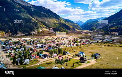 View Above Of Small Mining Town In Valley With Background Of Large