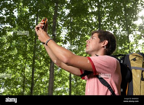 Man Holding GPS System Up Stock Photo Alamy