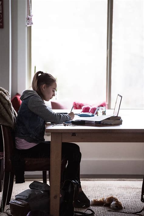 Teen Girl Doing Homework By Stocksy Contributor Ronnie Comeau Stocksy
