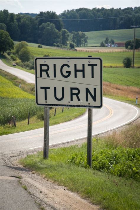 Right Turn Sign A Sign Warns Of A Sharp Right Turn On A Country Road