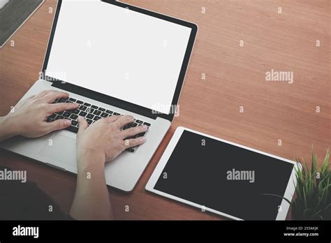 Businessman Hand Working With Blank Screeen New Modern Computer Laptop And Pro Digital Tablet On