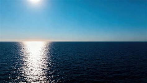 Bright Sun Reflects Brilliantly Upon The Deep Blue Expanse Of The Open