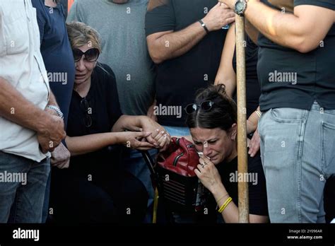 Mother Oksana Lobanov Left And Widow Michal Lobanov Right Mourn At
