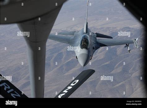 A Kc 153 From The 161st Air Refueling Wing Refuels A F 16 Fighter Jet From The 162nd Fighter
