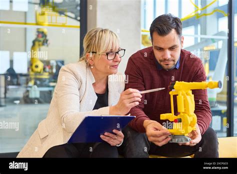 two engineers collaborating on the design and functionality of a