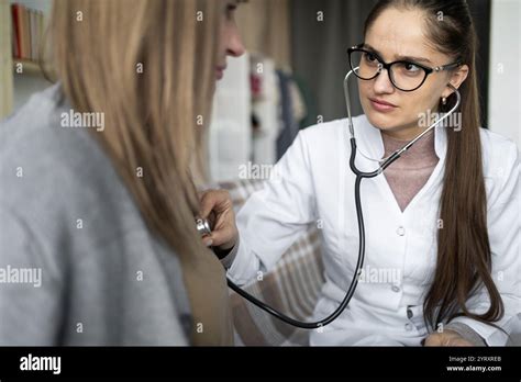 Heart And Lungs Checkup Female Doctor Using Stethoscope Listening To
