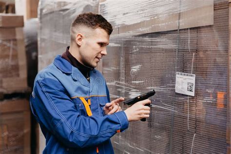 Close Up Of Warehouse Worker Scanning Barcodes On Boxes In A Large Warehouse Stock Image Image
