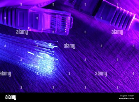 Optical Fiber Strands Transmitting Color Light And Cable With Modular Connectors On Table