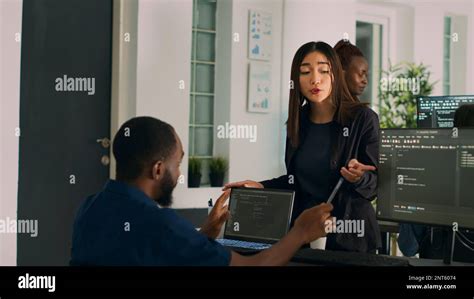 Diverse Database Developers Doing Highfive Gesture With Colleague