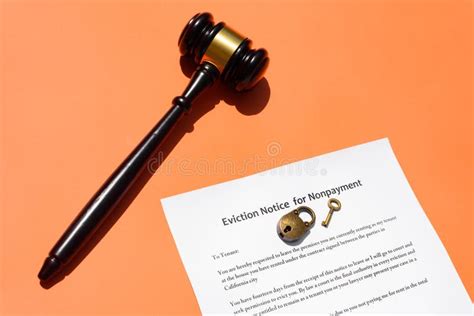 Eviction Notice On A Warm Orange Background And Some House Keys Stock