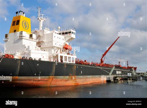 Fuel Crude Oil Tanker Ship Ice Beam Offloading Fuel At Terminal Stock