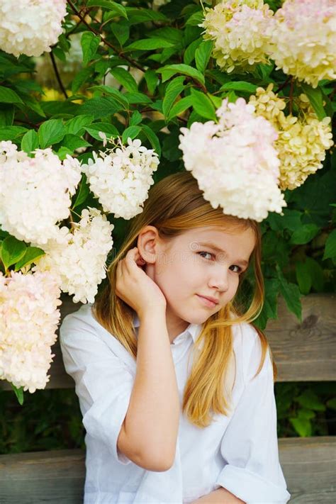 Cute Teenage Girl In Flowering Hydrangea Bushes Stock Image Image Of