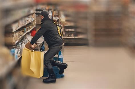 Premium Ai Image A Gang Of Ai Generated Shoplifters Gang Robbing A