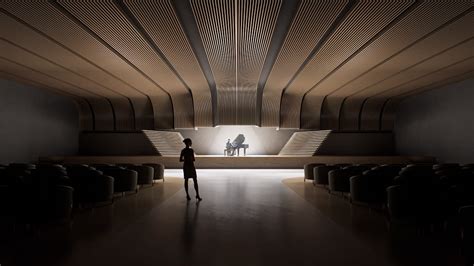 A Person Standing In Front Of A Stage In A Dark Concert Hall A Man Is