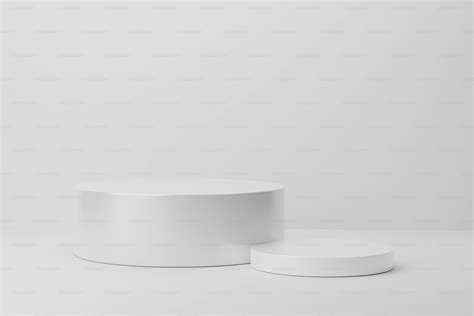 회색 배경에 밝은 원형 연단의 3d 렌더링 둥근 받침대가 있는 추상적인 배경 제품을 보여주기 위한 빈 무대 사진 Unsplash의 개념 이미지