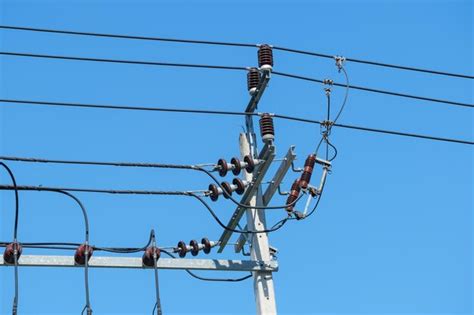 Premium Photo Low Angle View Of Electricity Transformer Against Clear Blue Sky