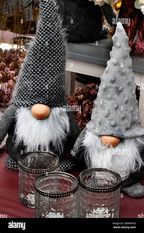 Dwarfs With Long Beards And Huge Woolly Hats In A Garden Centre
