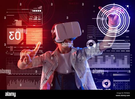 Concentrated Girl Using Virtual Reality While Creating A Program Stock