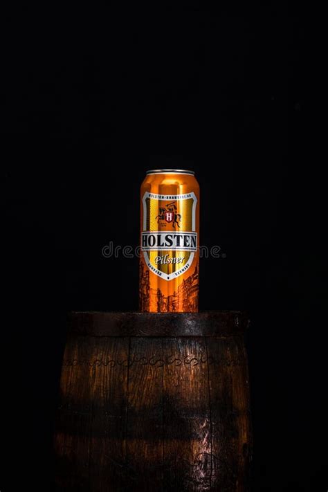Can Of Holsten Beer On Beer Barrel With Dark Background Illustrative