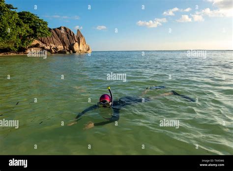 Seychelles La Digue Anse Source D´argent Woman Snorkeling Stock