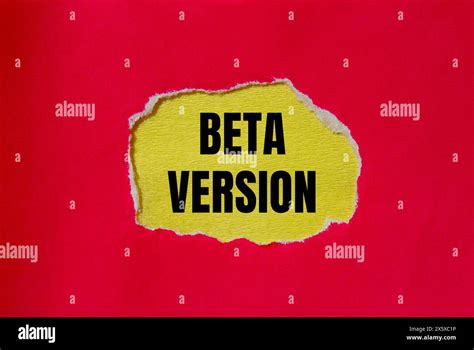 Beta Version Words Written On Ripped Red Paper With Yellow Background Conceptual Beta Version