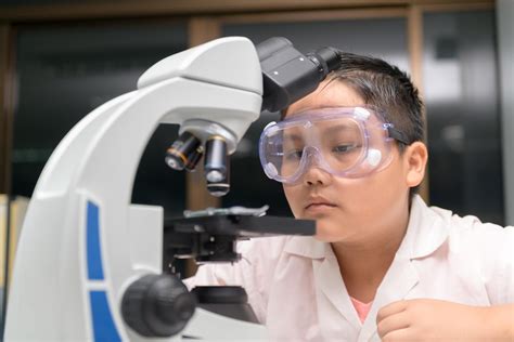 Premium Photo Cute Girl Using Microscope In Laboratory