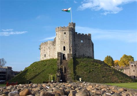 Download A Castle With A Flag On Top Of It Wallpaper