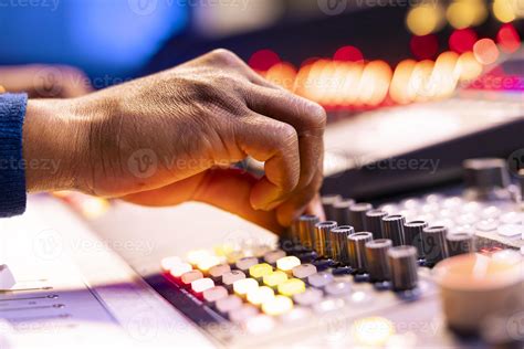 African American Sound Engineer Operates Audio Console In Control Room