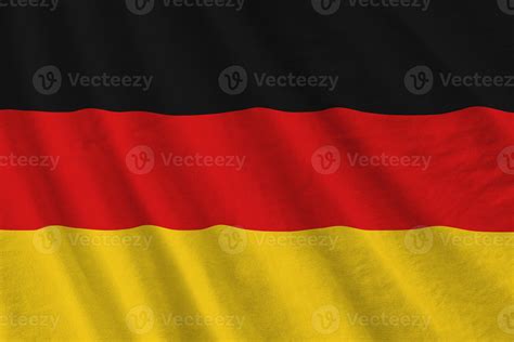 Germany Flag With Big Folds Waving Close Up Under The Studio Light