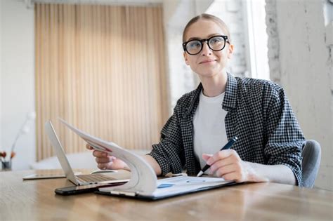 Premium Photo A Female Programmer Works Uses A Laptop Makes A Report
