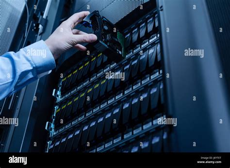 Close Up Of A Hard Drive Being Put Into Server Rack Stock Photo Alamy