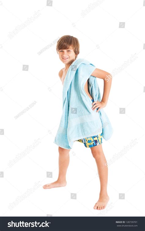 Cute European Teen Boy In Swimming Shorts With A Naked Torso With A Blue Towel Over His