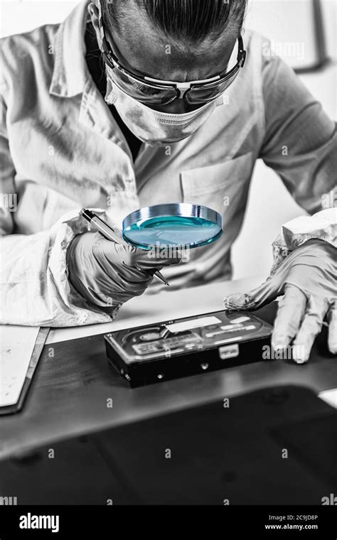 Forensic Science Data Forensic Analyst Examining Laptop Computer Stock Photo By Microgen