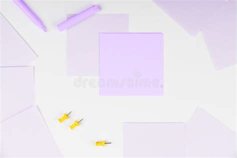 Notebook And Colored Papers Stickers Lying On White Desk Multiple