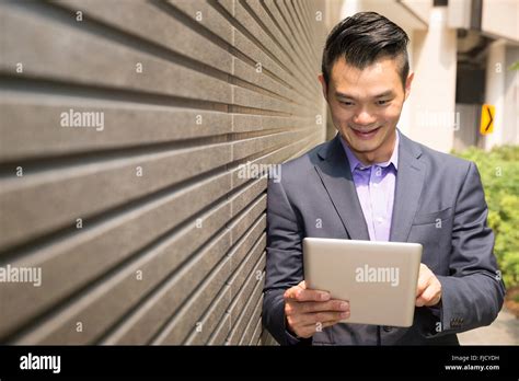 chinese man with a tablet computer asian business man using digital