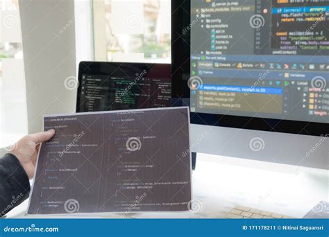 Programmers Work On The Development Of Coding And Coding Technology On White Desks And Website