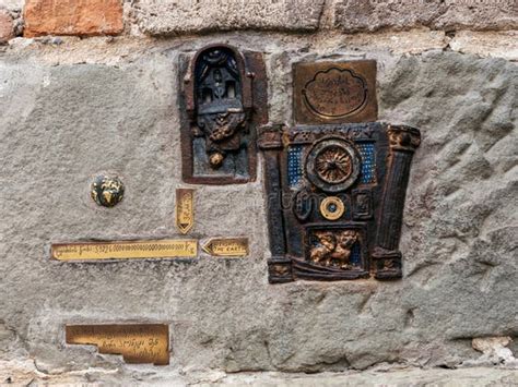 Artistic Detail Of The Smallest Clock On The Wall Near The Leaning