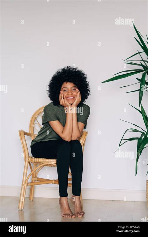 Full Body Of Positive Barefoot African American Female Looking At