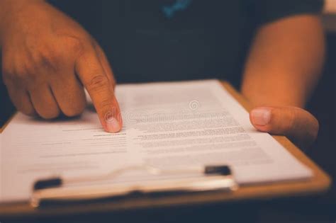 Document And Data Analysis Concept Man Hand Holding Or Handing Over Document Paperwork On