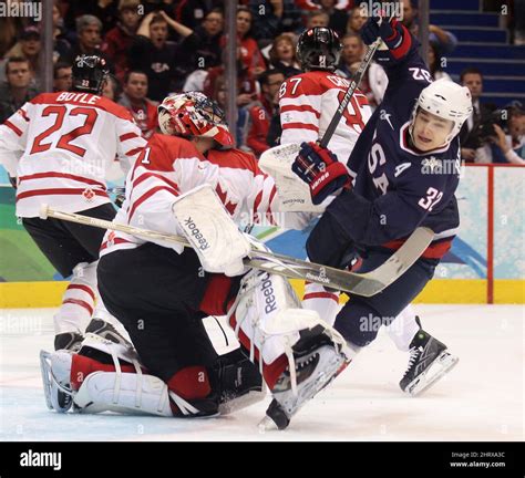 Usas Dustin Brown Drives To Canadas Roberto Luongos Net During First Period Mens Ice Hockey