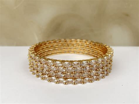 American Diamond Thin Elongated Bright Gold And White Churi Set Chohans Jewellery